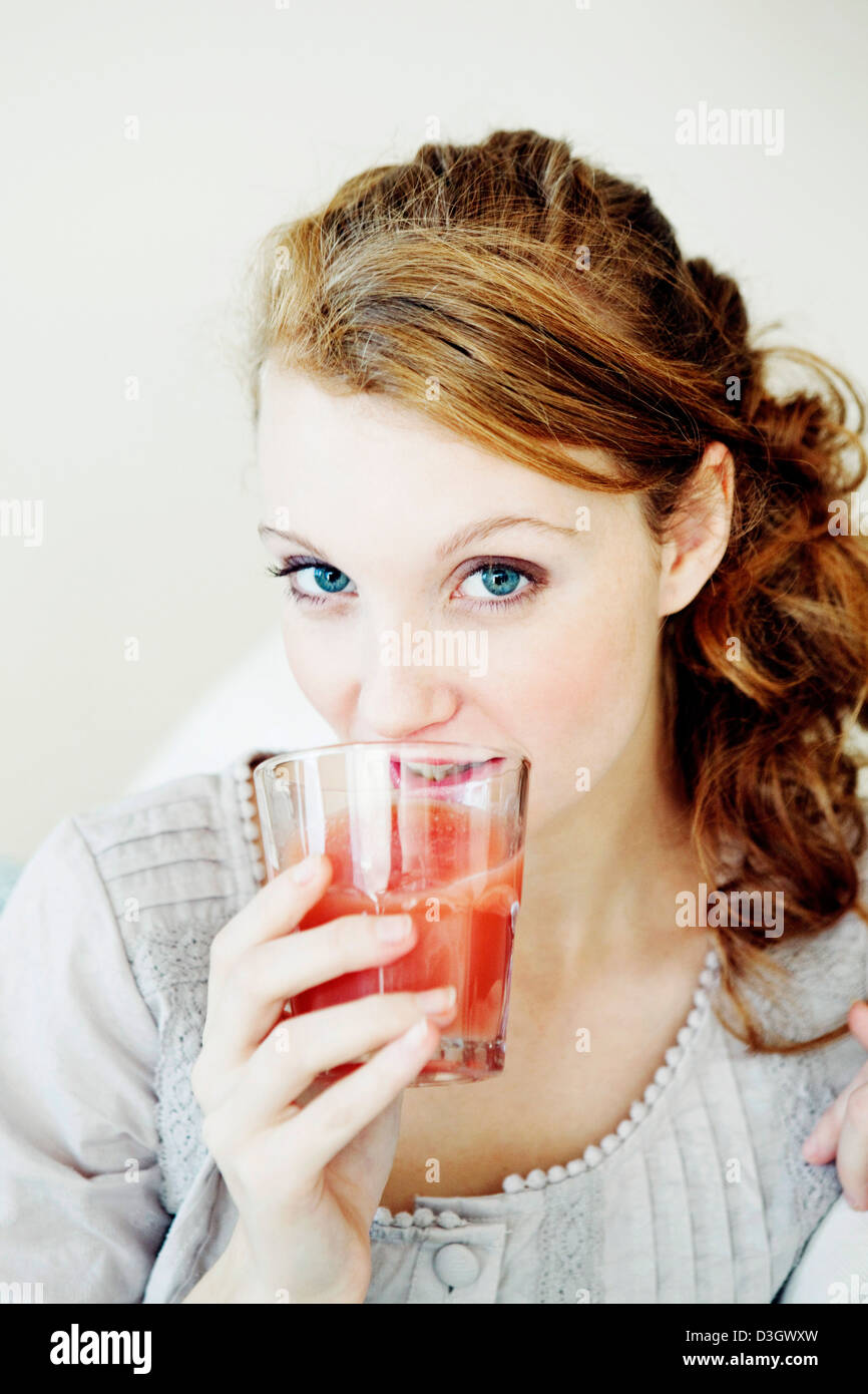 WOMAN WITH COLD DRINK Stock Photo - Alamy