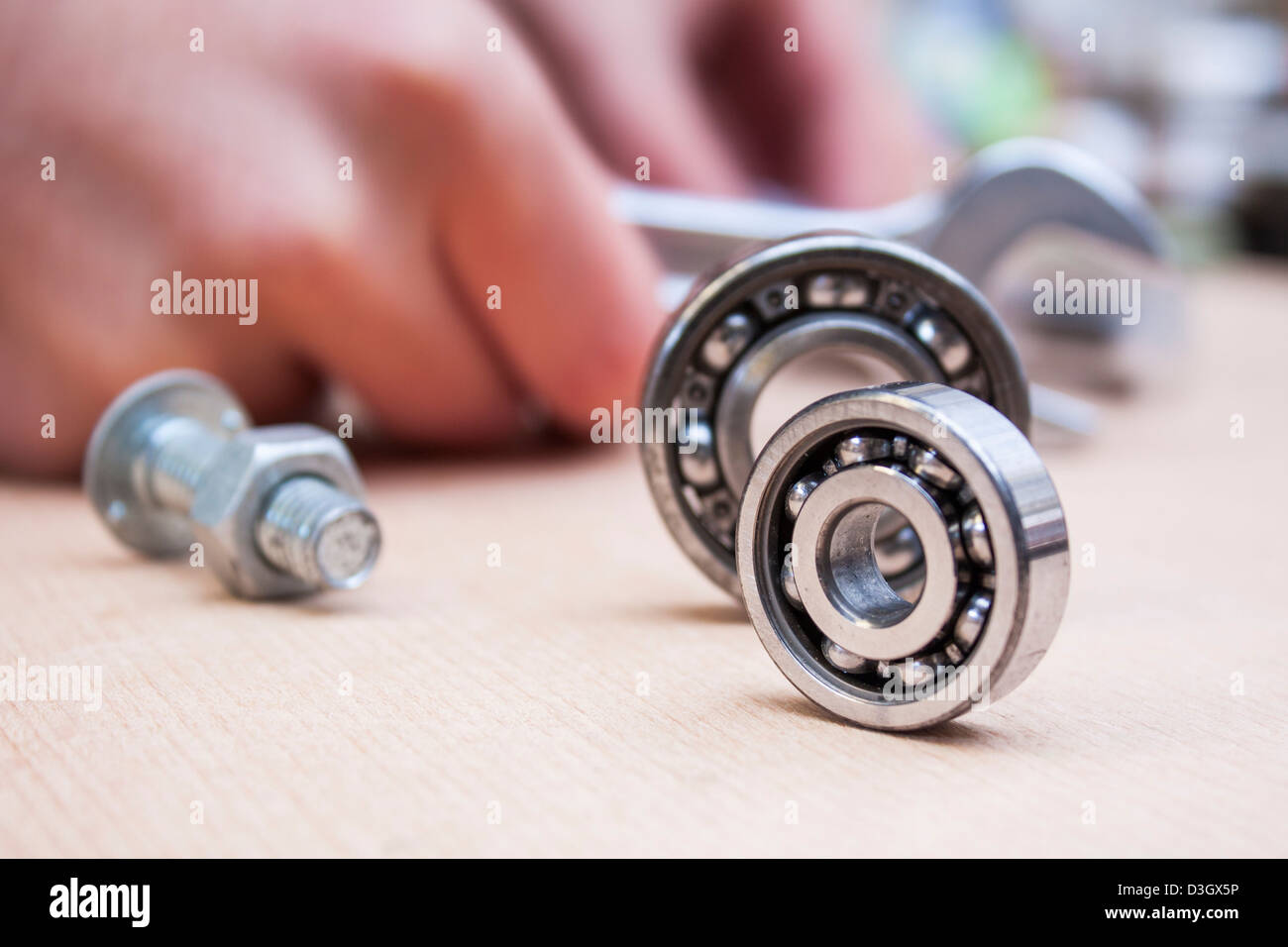 roller bearing and mechanic with tools Stock Photo - Alamy