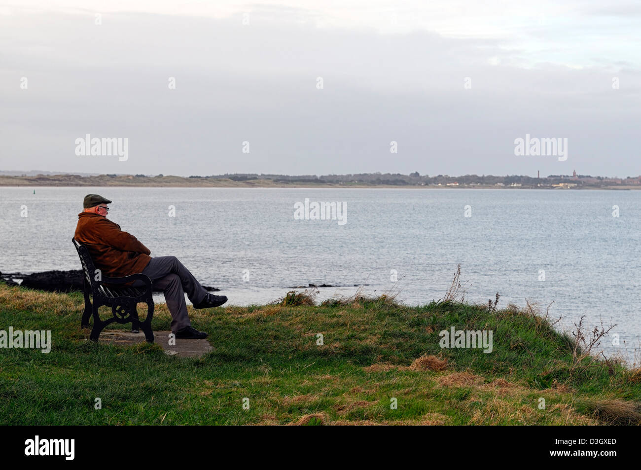 old elderly man lone single alone on own sit sitting bench look looking ...