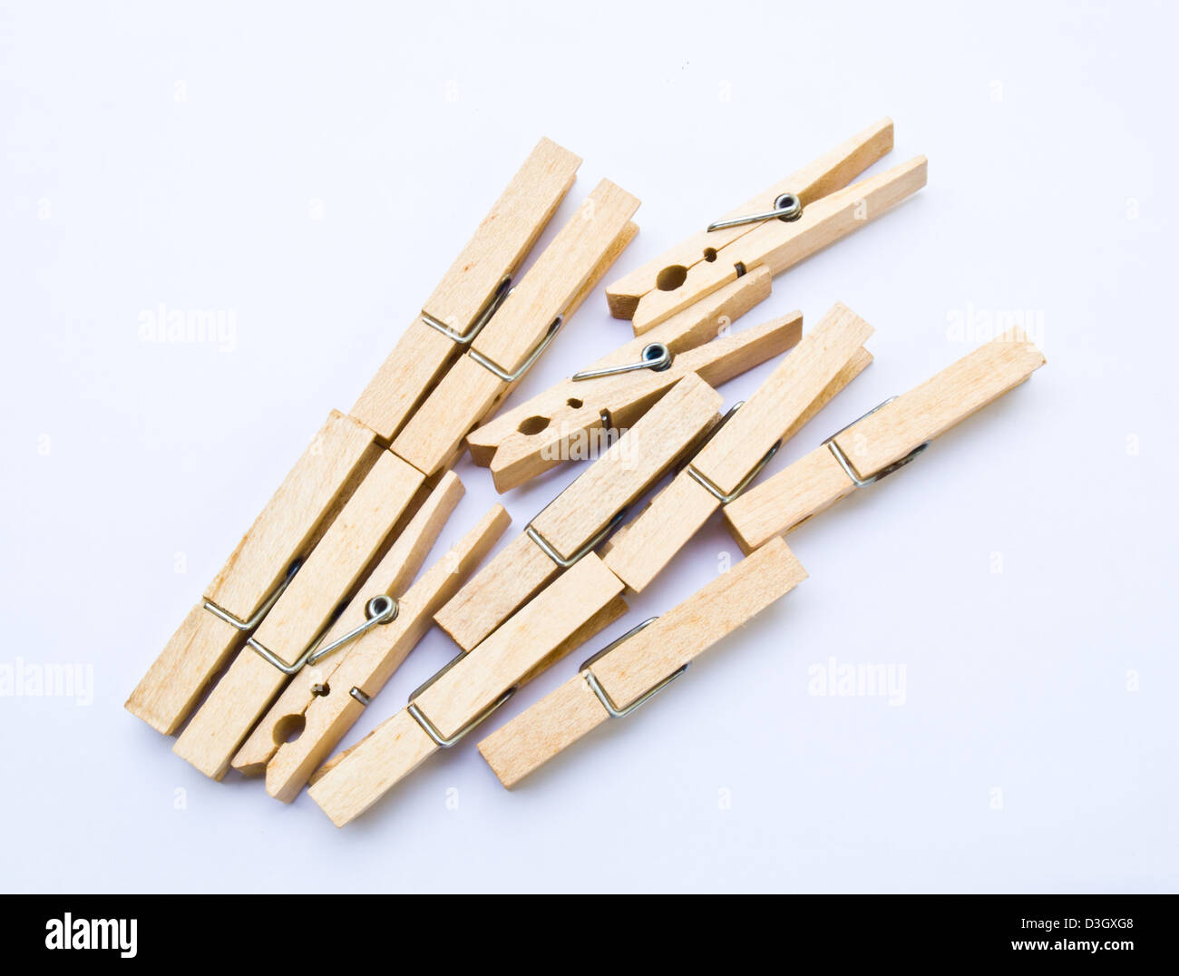 Wooden clothes clips isolated on white background Stock Photo - Alamy