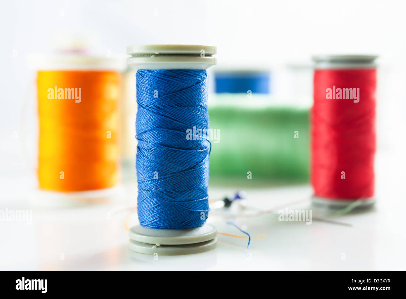 Many different sized colored and shaped thread reels Stock Photo - Alamy