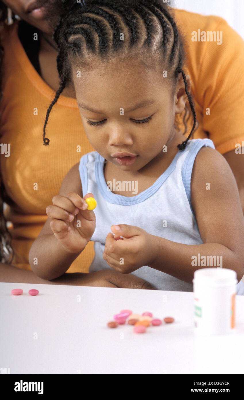 CHILD TAKING MEDICATION Stock Photo - Alamy