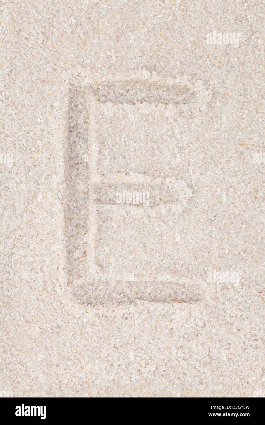 Alphabet writing on the sand - Letter E Stock Photo - Alamy