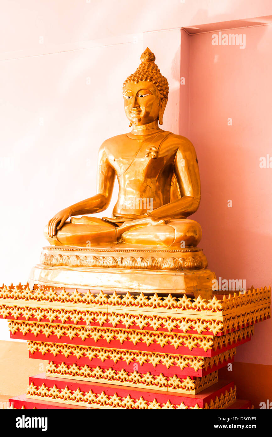 Sitting bronze buddha image statue at side Stock Photo - Alamy