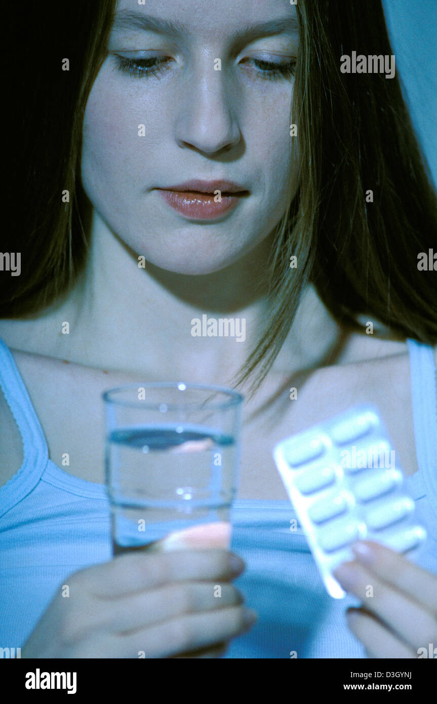 WOMAN TAKING MEDICATION Stock Photo - Alamy