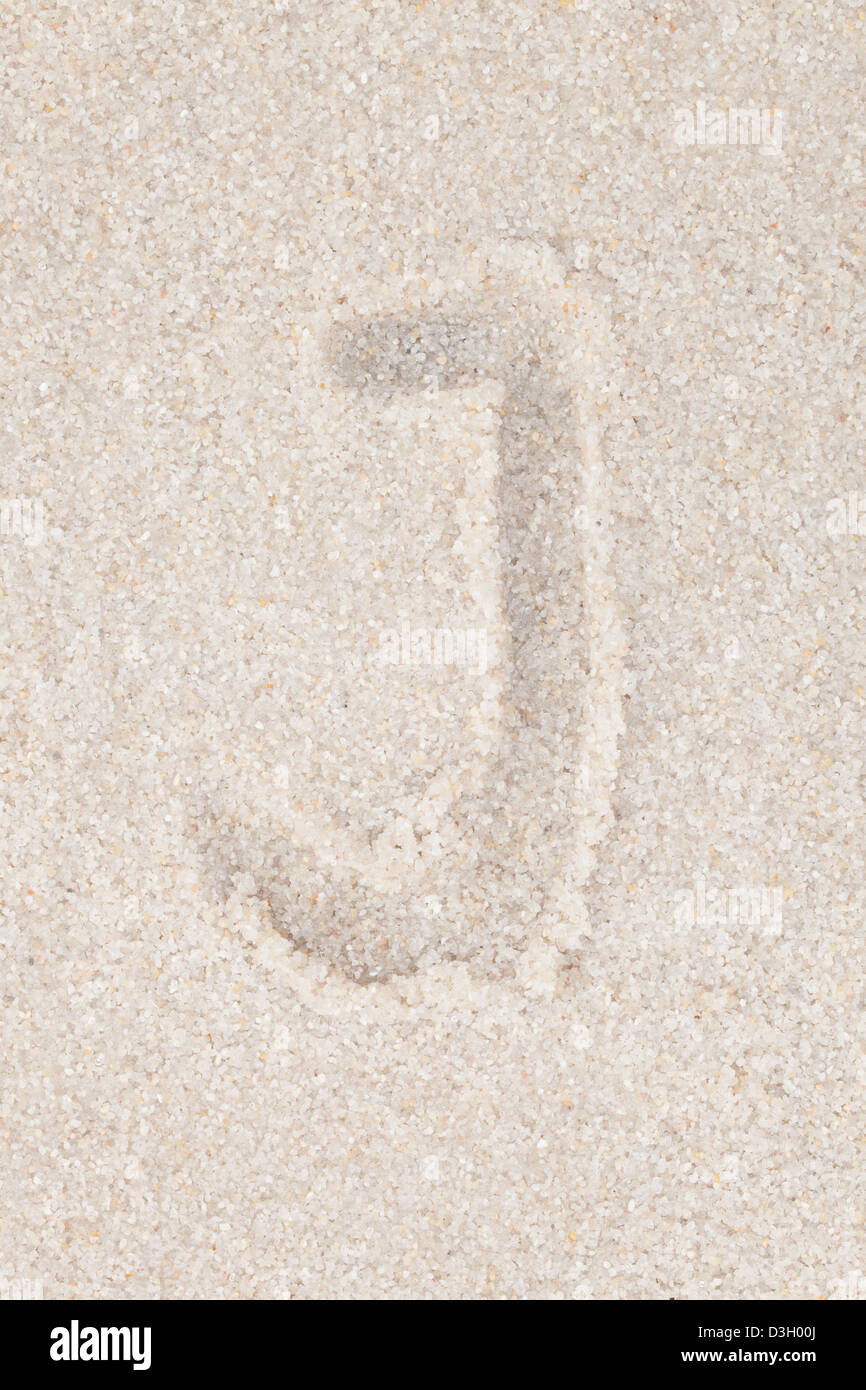 Alphabet writing on the sand - Letter J Stock Photo - Alamy