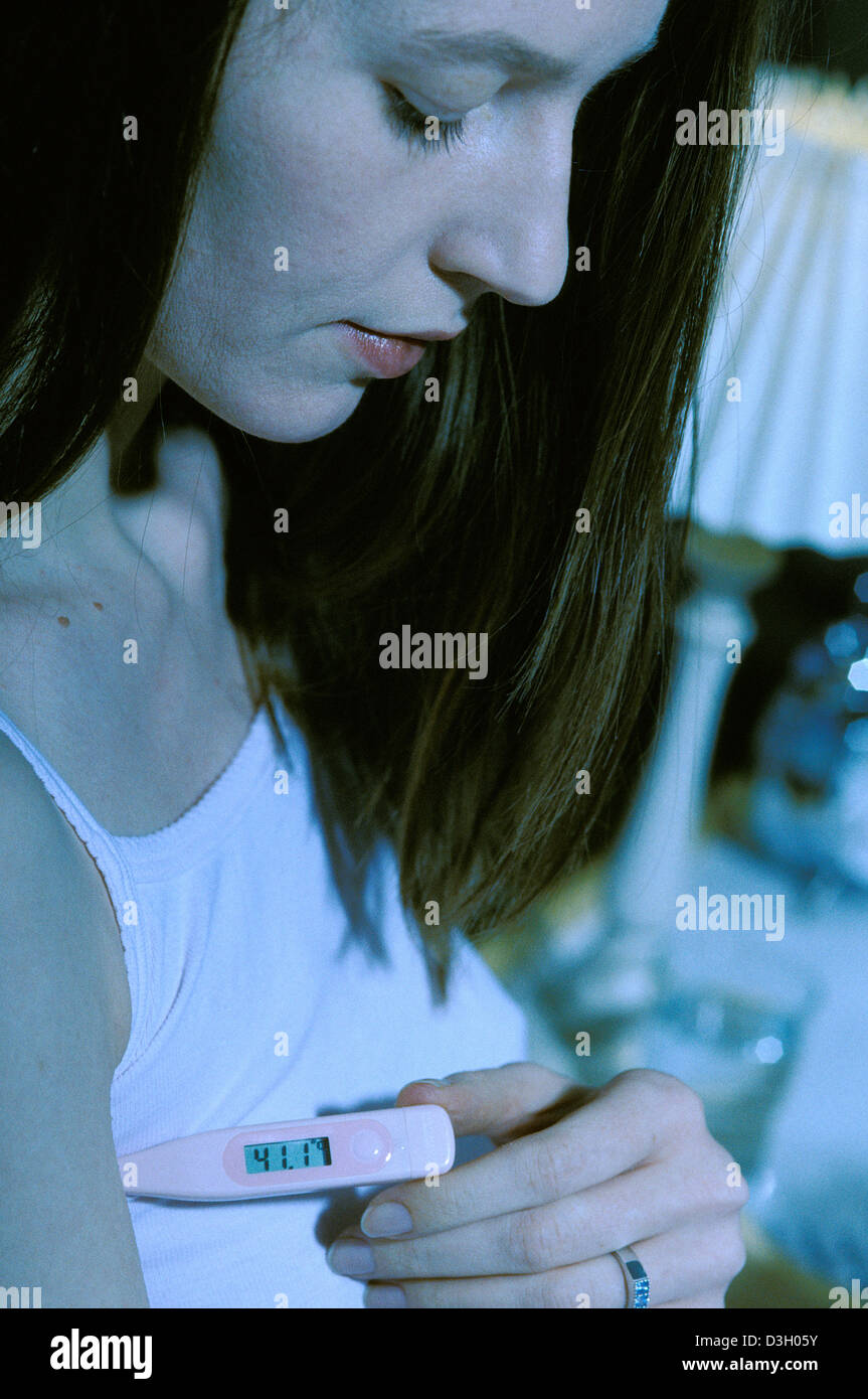 WOMAN WITH FEVER Stock Photo - Alamy