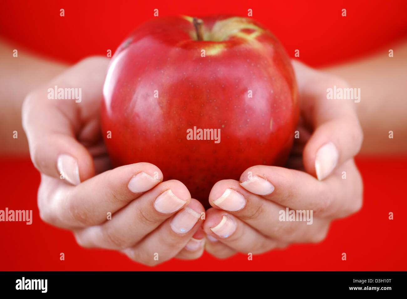 red apple in hand close up Stock Photo - Alamy