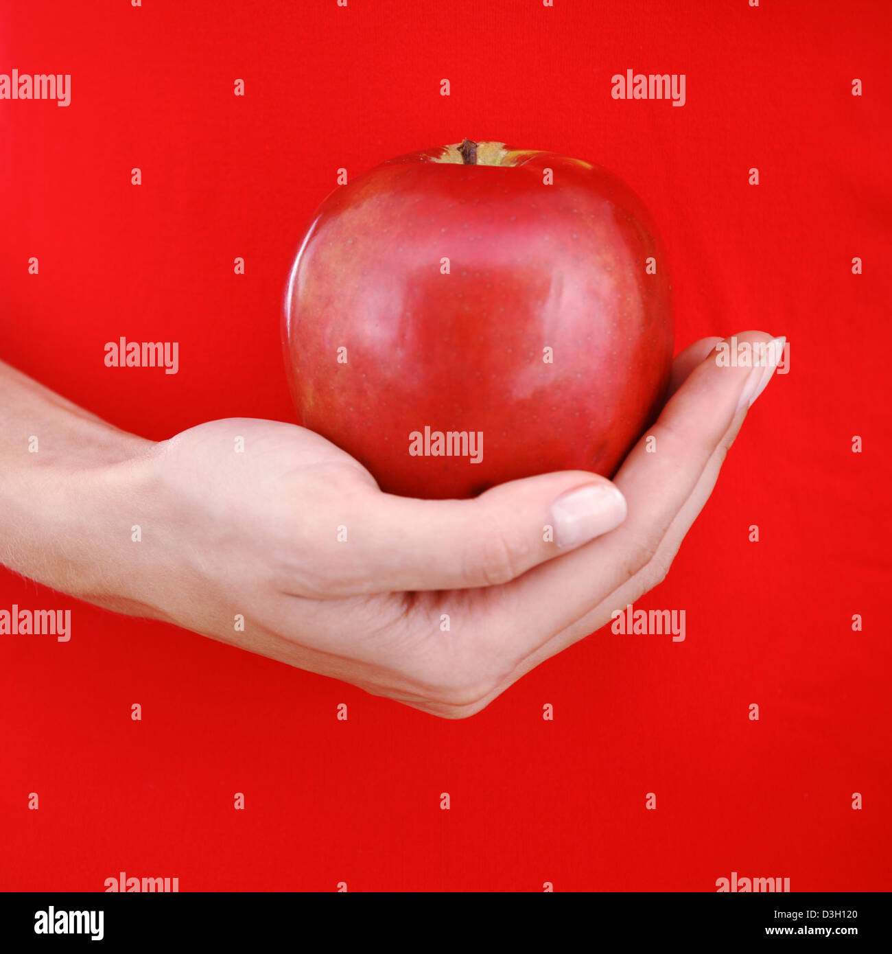 red apple in hand close up Stock Photo - Alamy