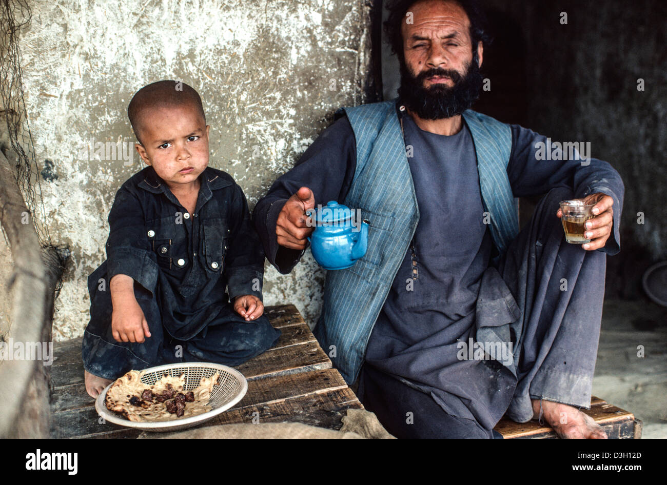Muslim father son eating hi-res stock photography and images - Alamy