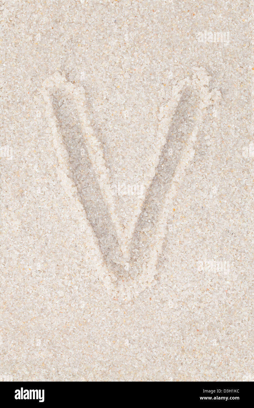 Alphabet writing on the sand - Letter V Stock Photo - Alamy
