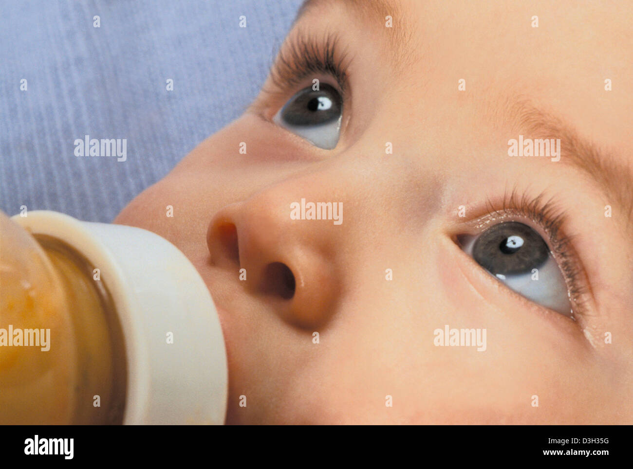 INFANT DRINKING FROM BABY BOTTLE Stock Photo - Alamy