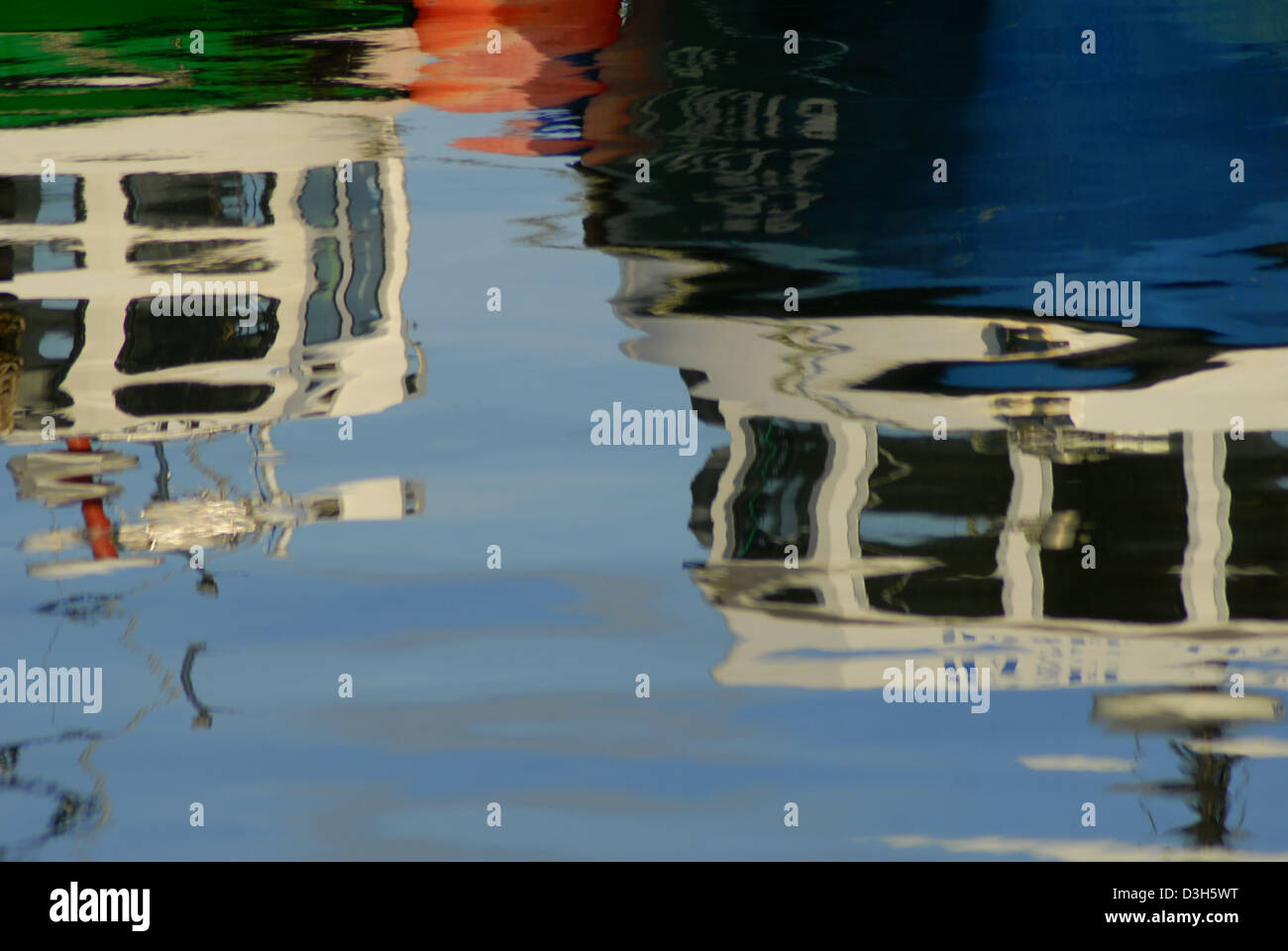 Reflection of fishing boats Stock Photo - Alamy