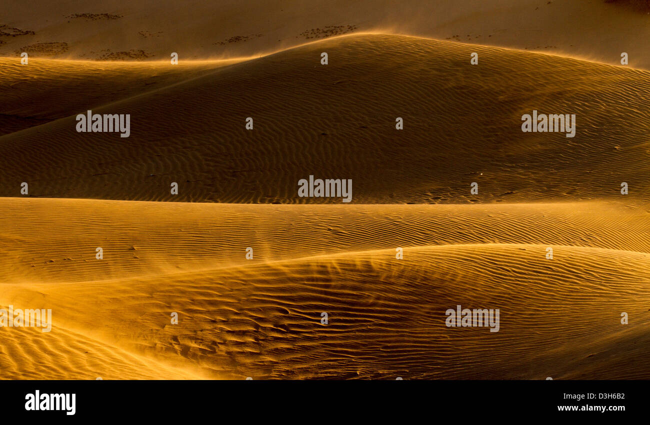 Late night sun shines across the sand dunes of Gran Canaria in the ...