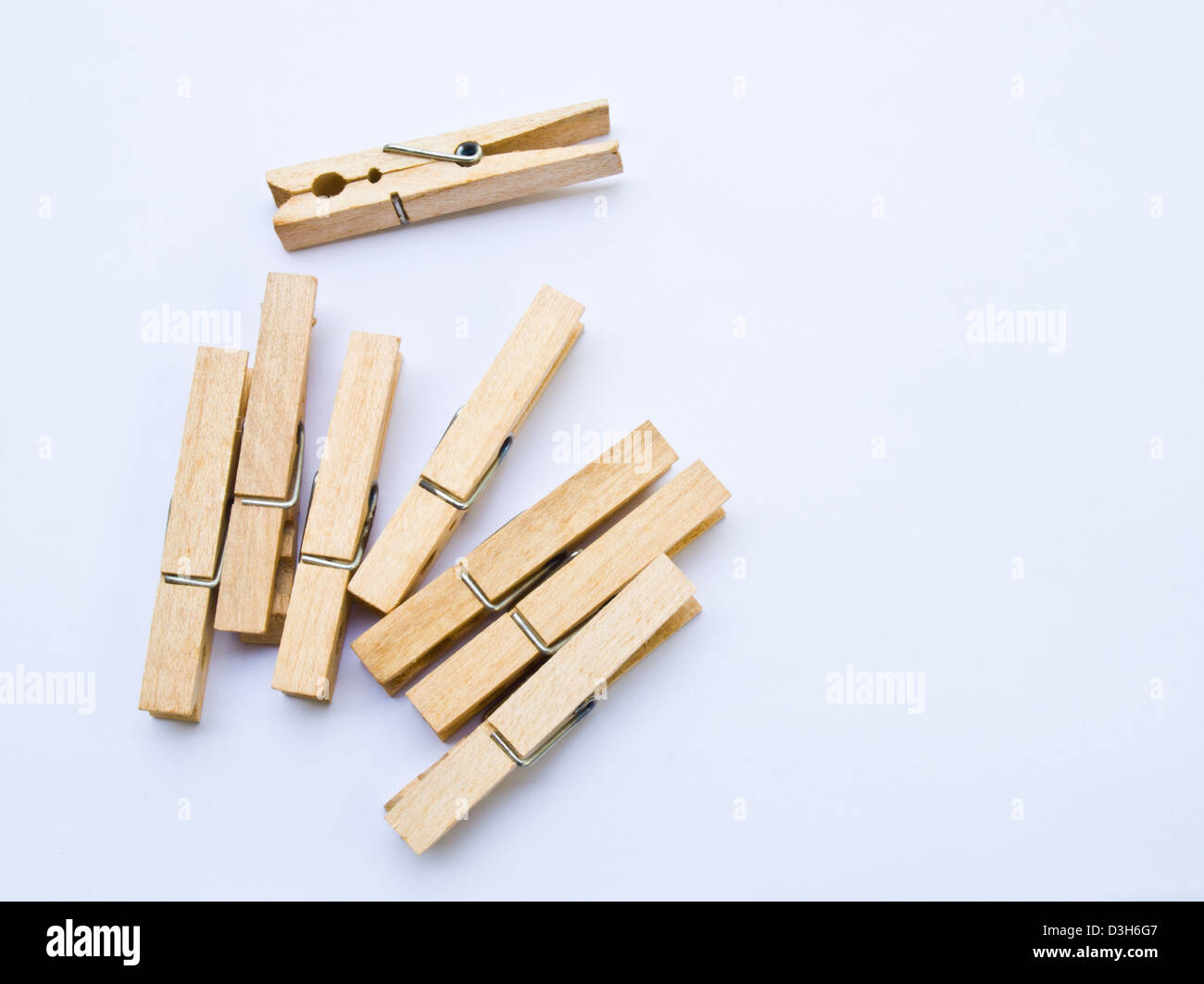 Wooden clothes clips isolated on white background Stock Photo - Alamy