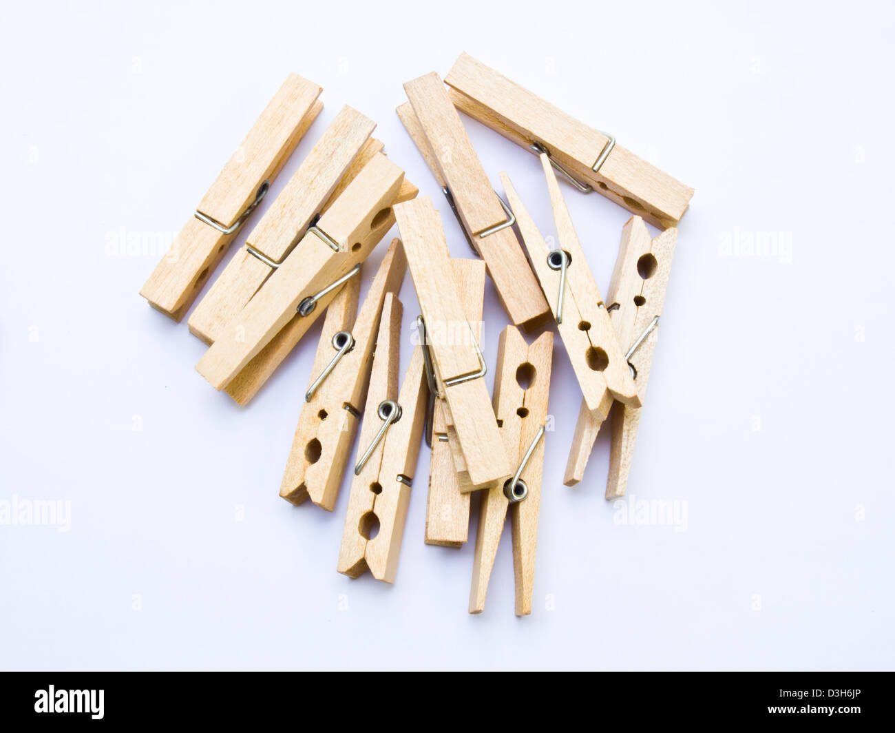 Wooden clothes clips isolated on white background Stock Photo - Alamy