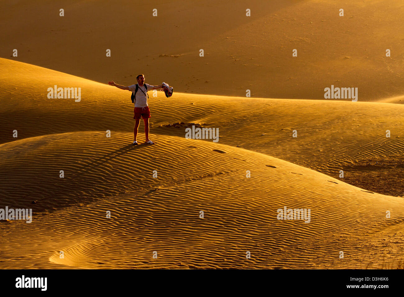 Late night sun shines across the sand dunes of Gran Canaria in the ...