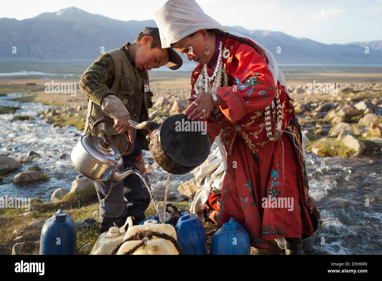 Women fetching water from a stream in the Wakhan Corridor, Badakhshan ...