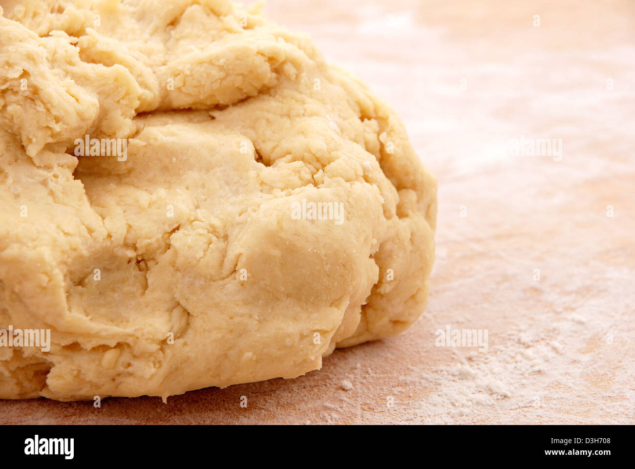 Detail of a fresh ball of pastry on a floured wooden board Stock Photo ...