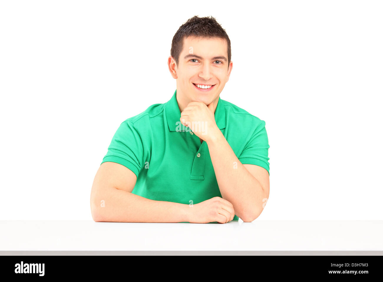 Young smiling man sitting, isolated on white background Stock Photo - Alamy