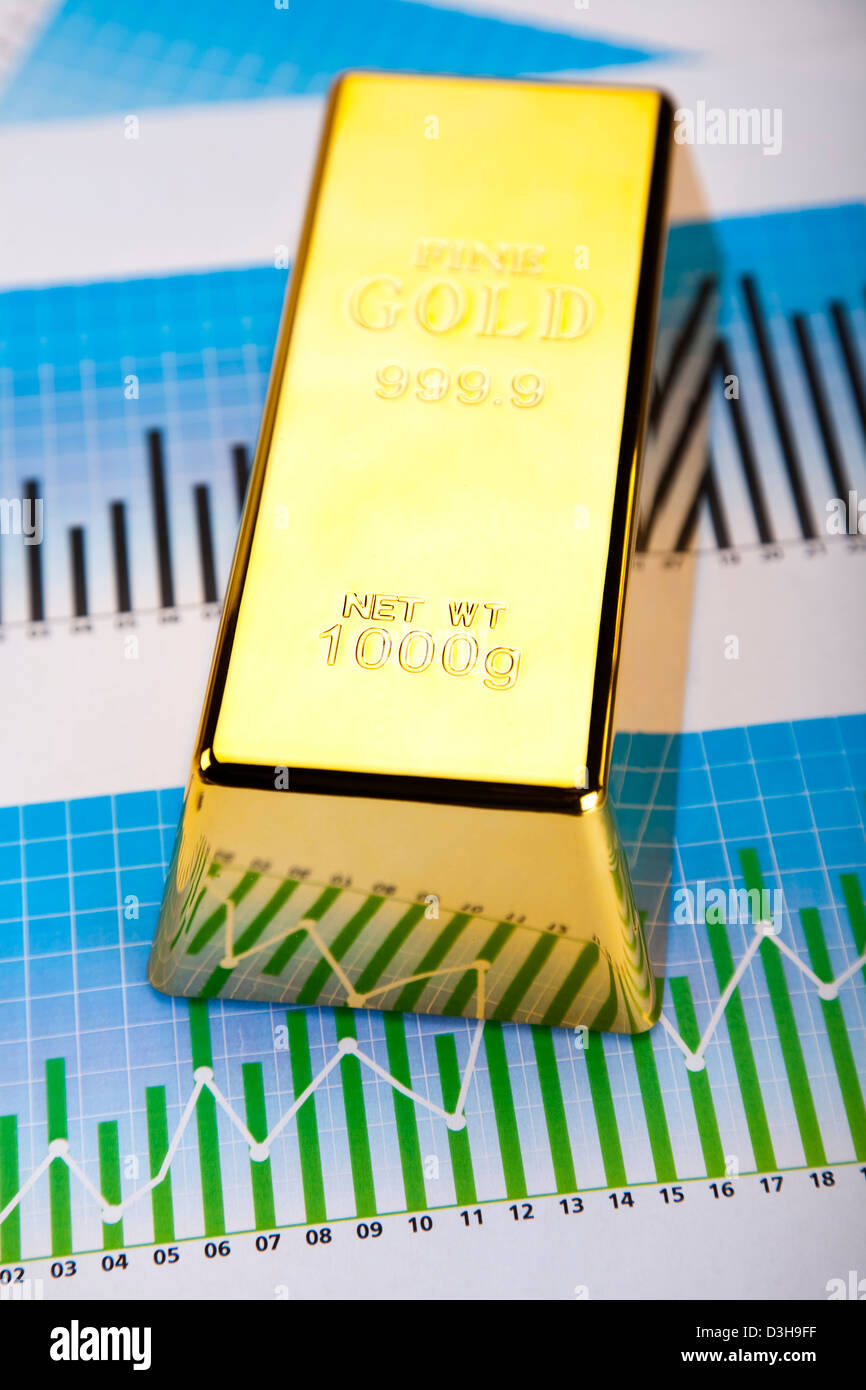 Gold bars with a linear graph Stock Photo - Alamy