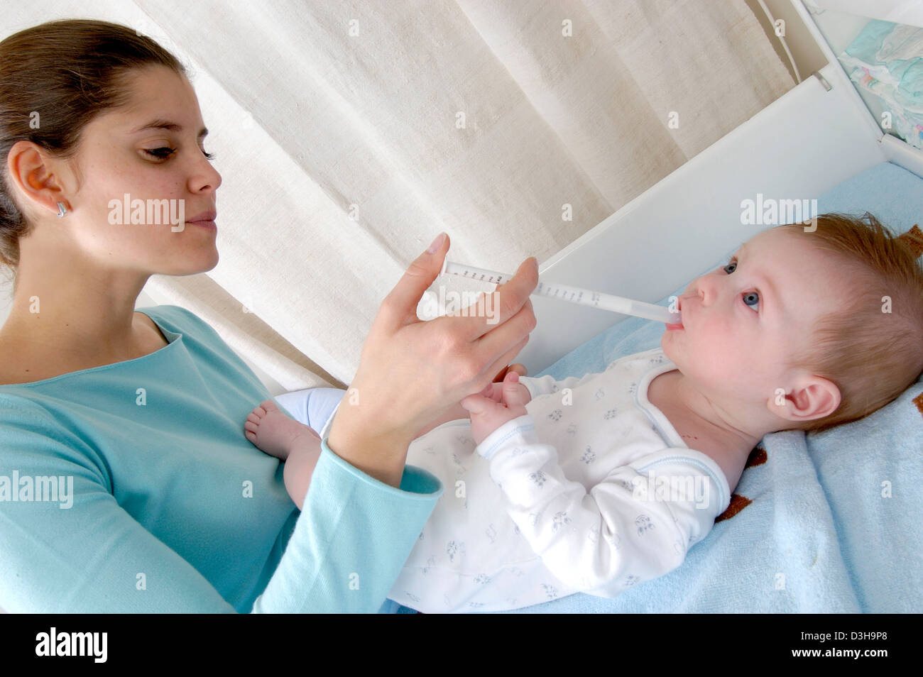 INFANT TAKING MEDICATION Stock Photo - Alamy