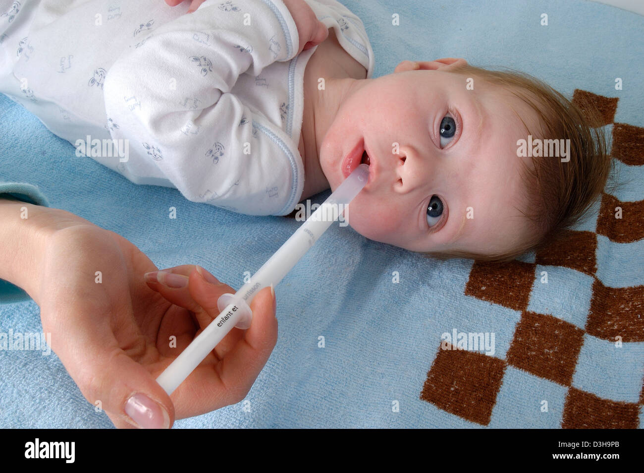 INFANT TAKING MEDICATION Stock Photo - Alamy