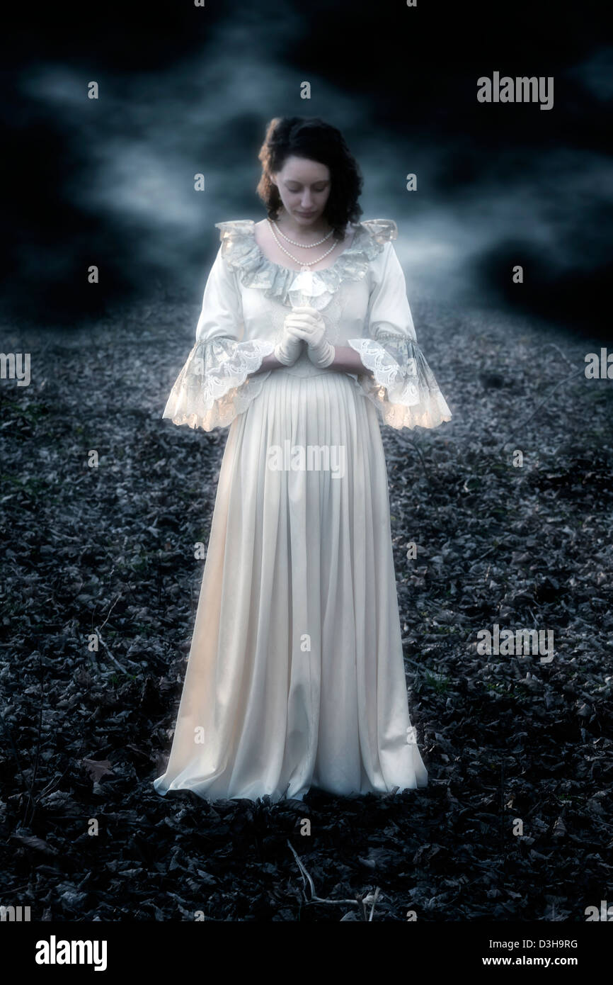 a praying period lady Stock Photo - Alamy