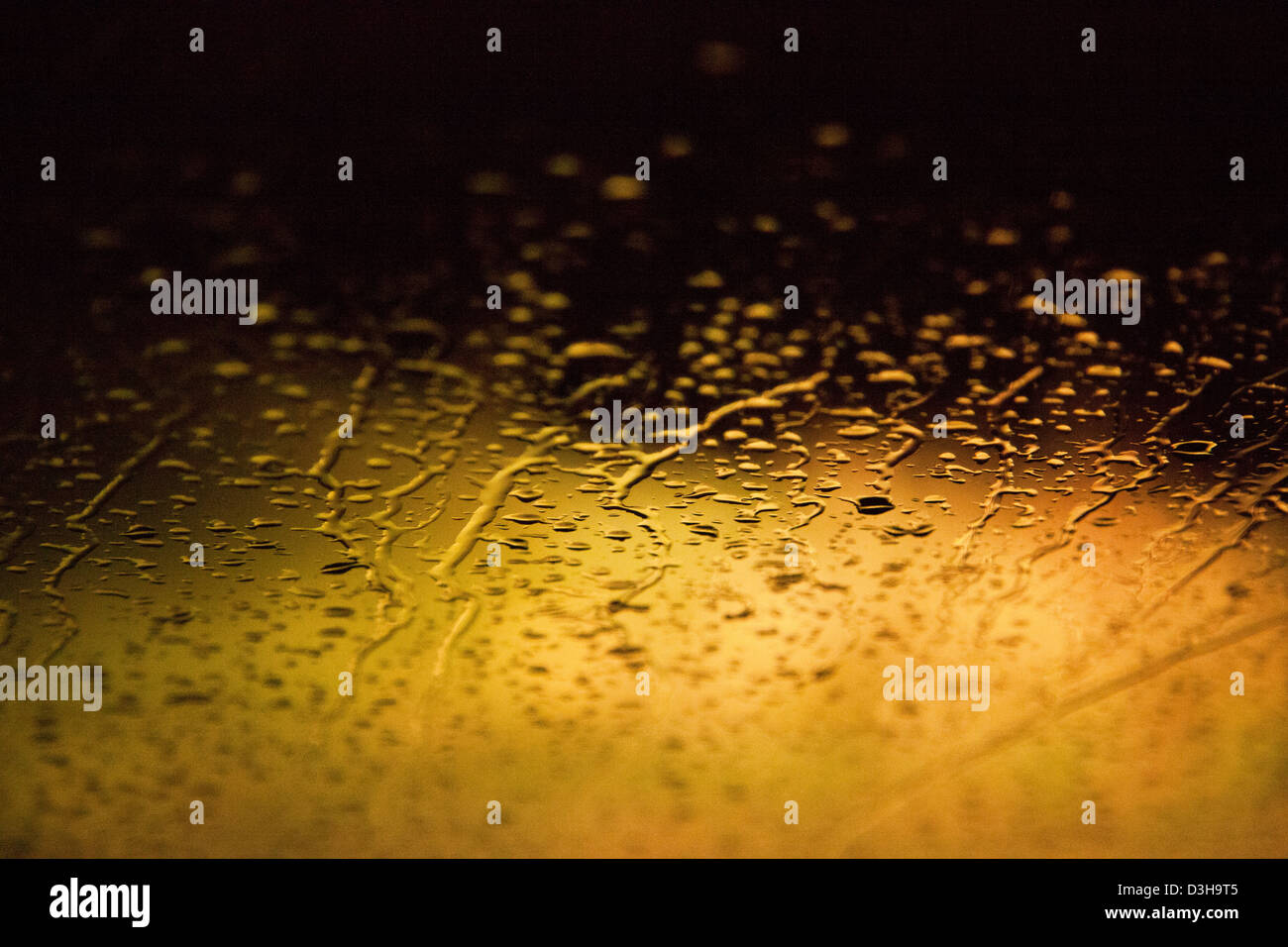 Water droplets on a car window at night Stock Photo - Alamy