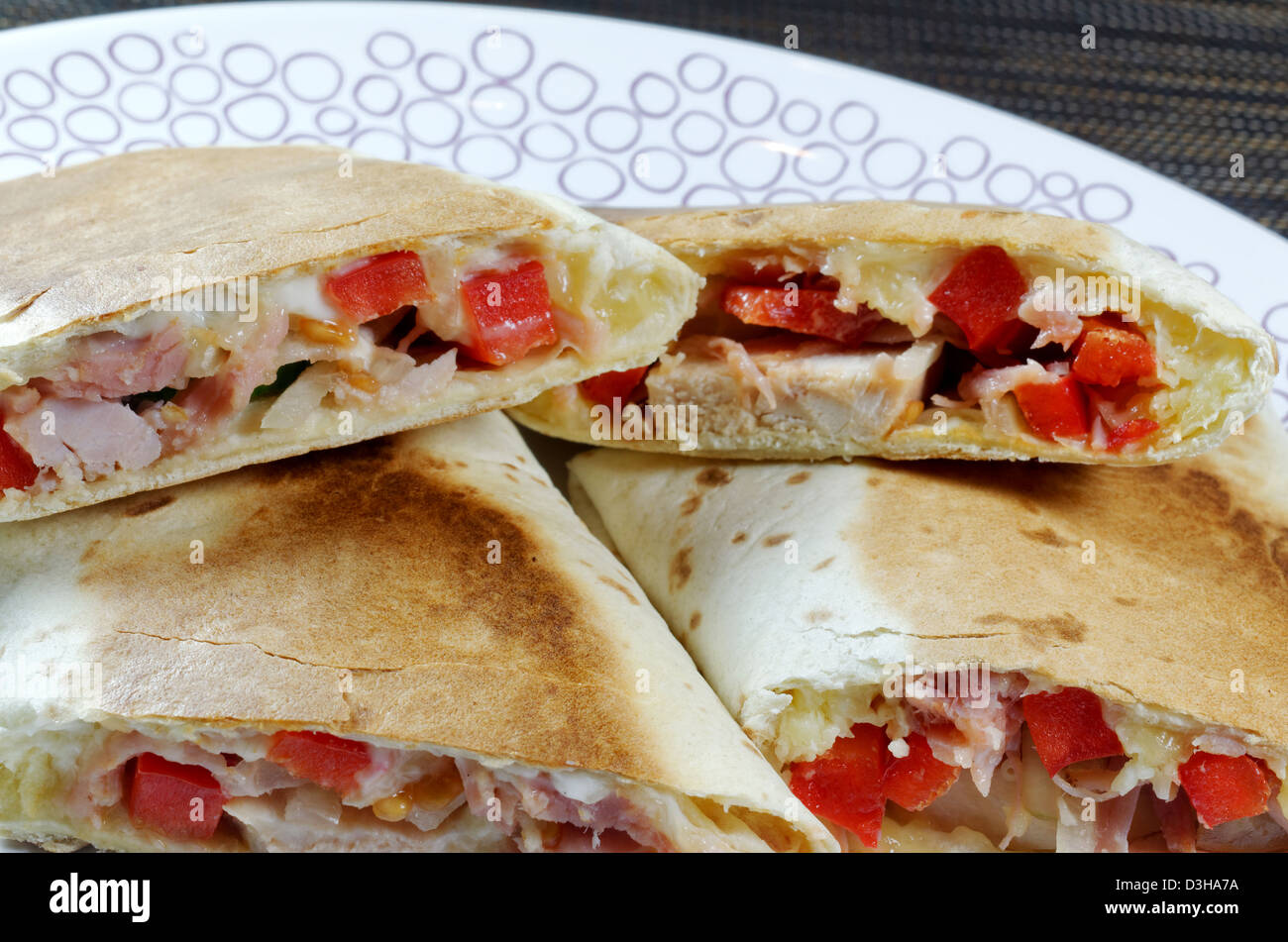 Toasted tortilla wraps filled with chicken and ham Stock Photo - Alamy