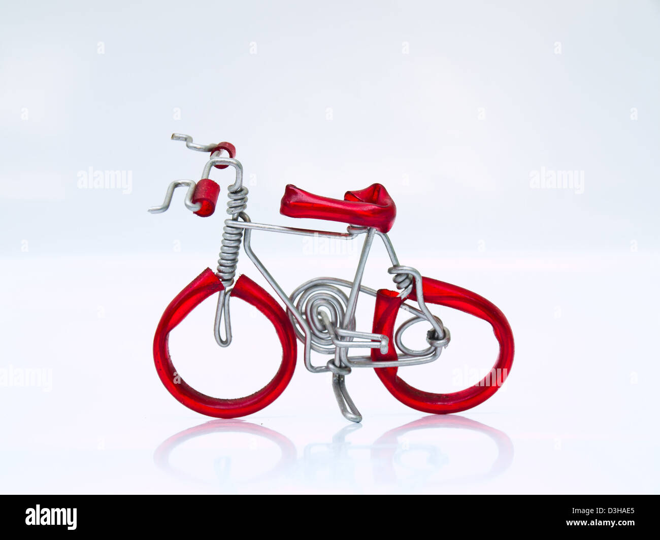 A red miniature bicycle isolated on white background Stock Photo - Alamy
