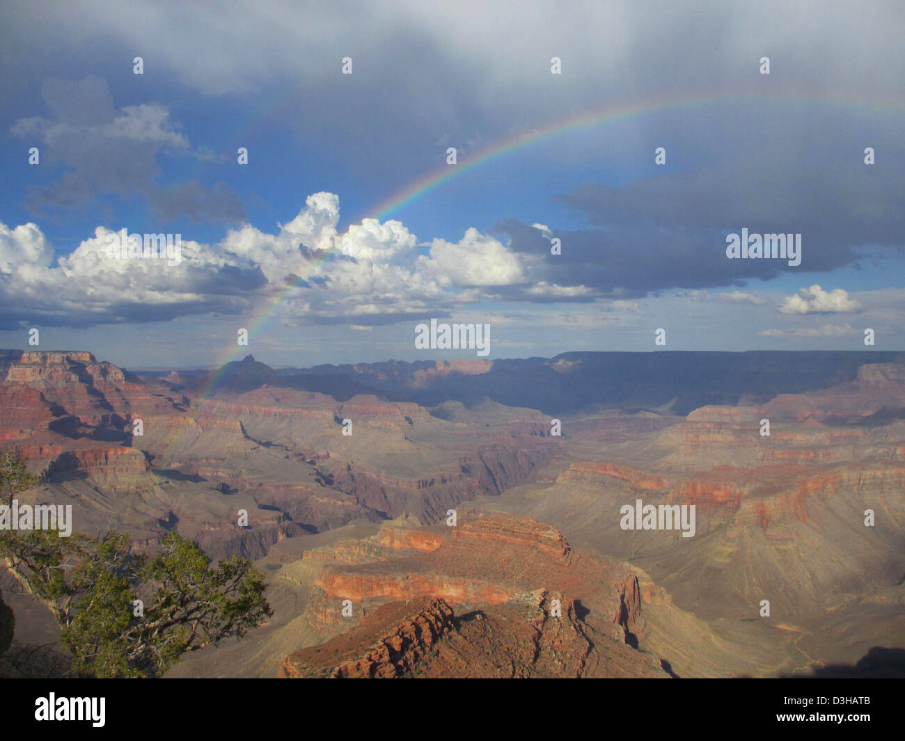 A rainbow arches over Shoshone Point in Grand Canyon National Park, showcasing the park's ...
