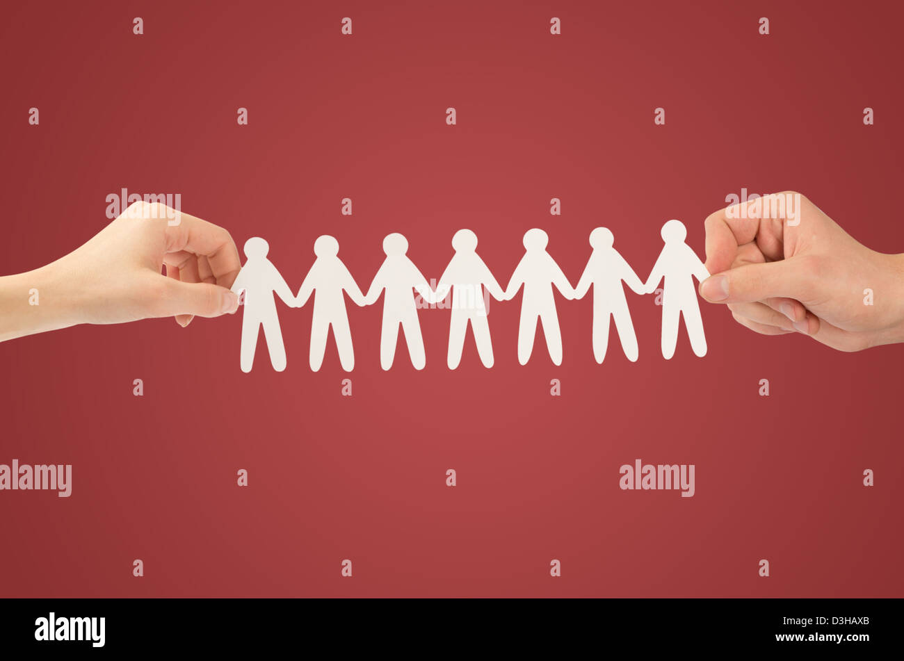 paper people in hands(man and woman Stock Photo - Alamy