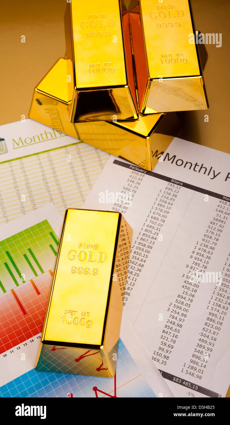 Gold bars with a linear graph Stock Photo - Alamy