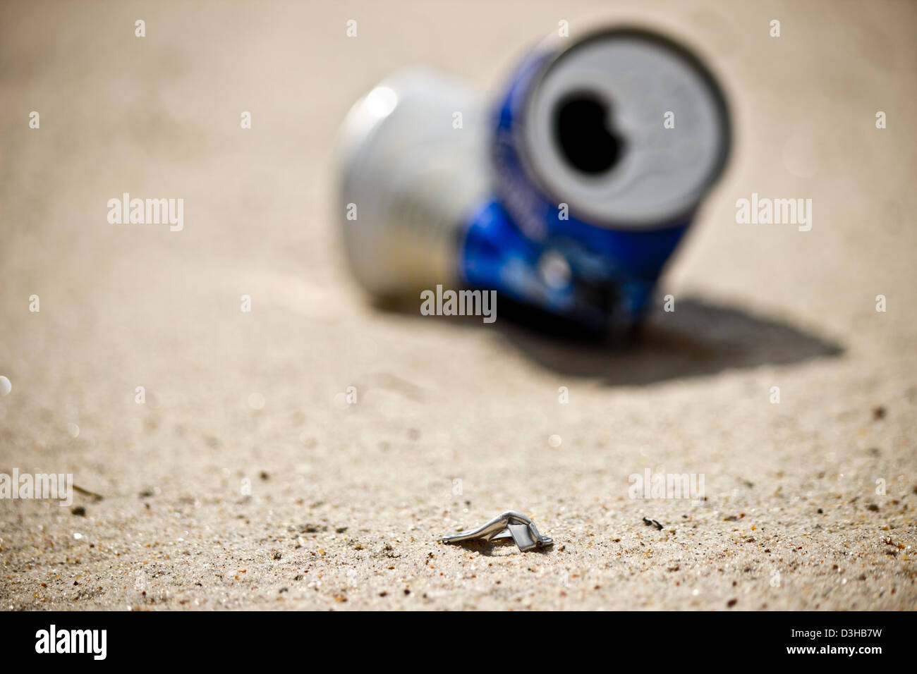 A beer can on sand Stock Photo - Alamy