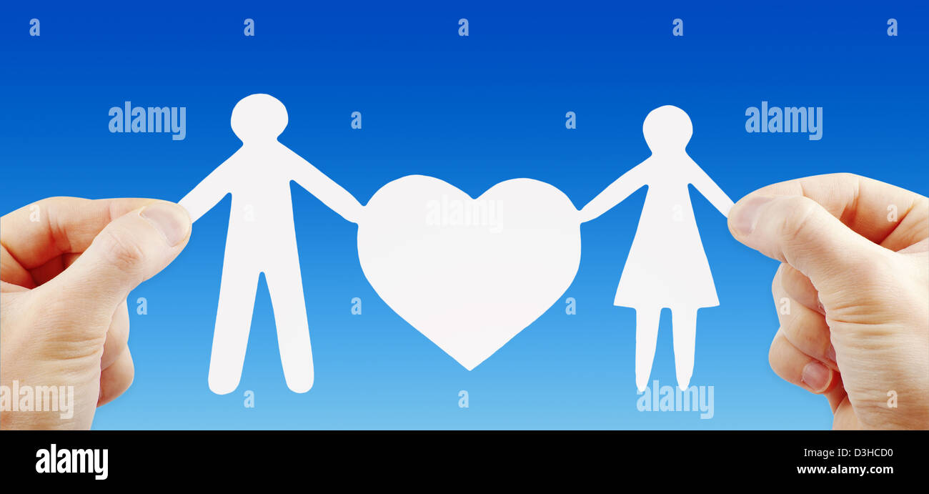 paper family with heart in hands Stock Photo - Alamy