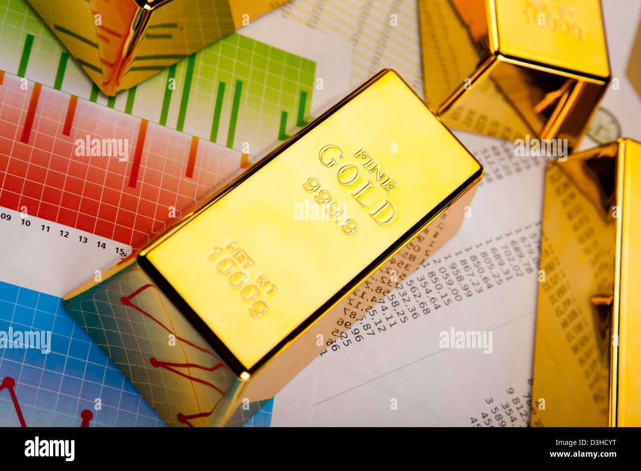 Gold bars with a linear graph Stock Photo - Alamy