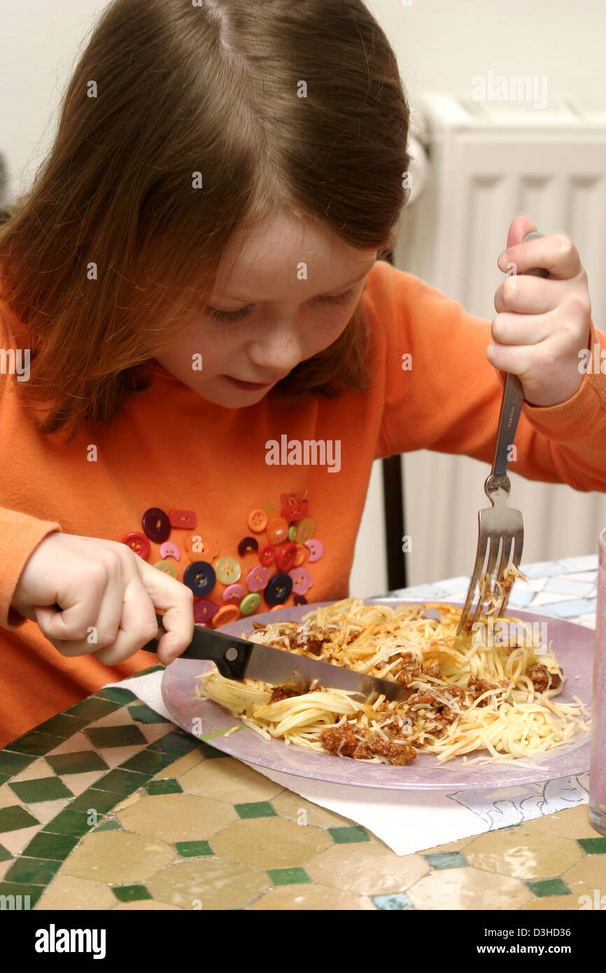 CHILD EATING MEAT Stock Photo - Alamy