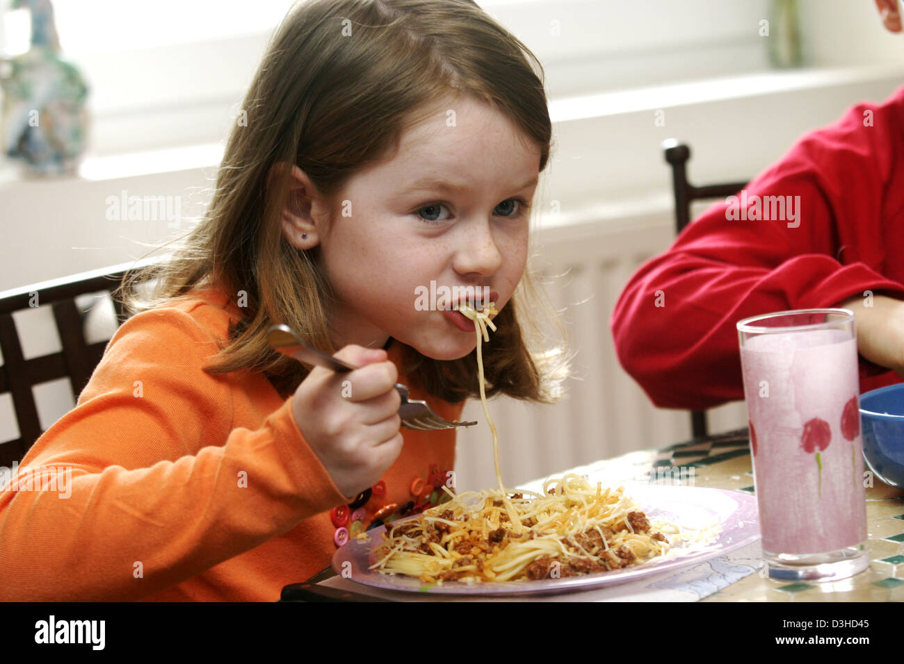 CHILD EATING A MEAL Stock Photo - Alamy