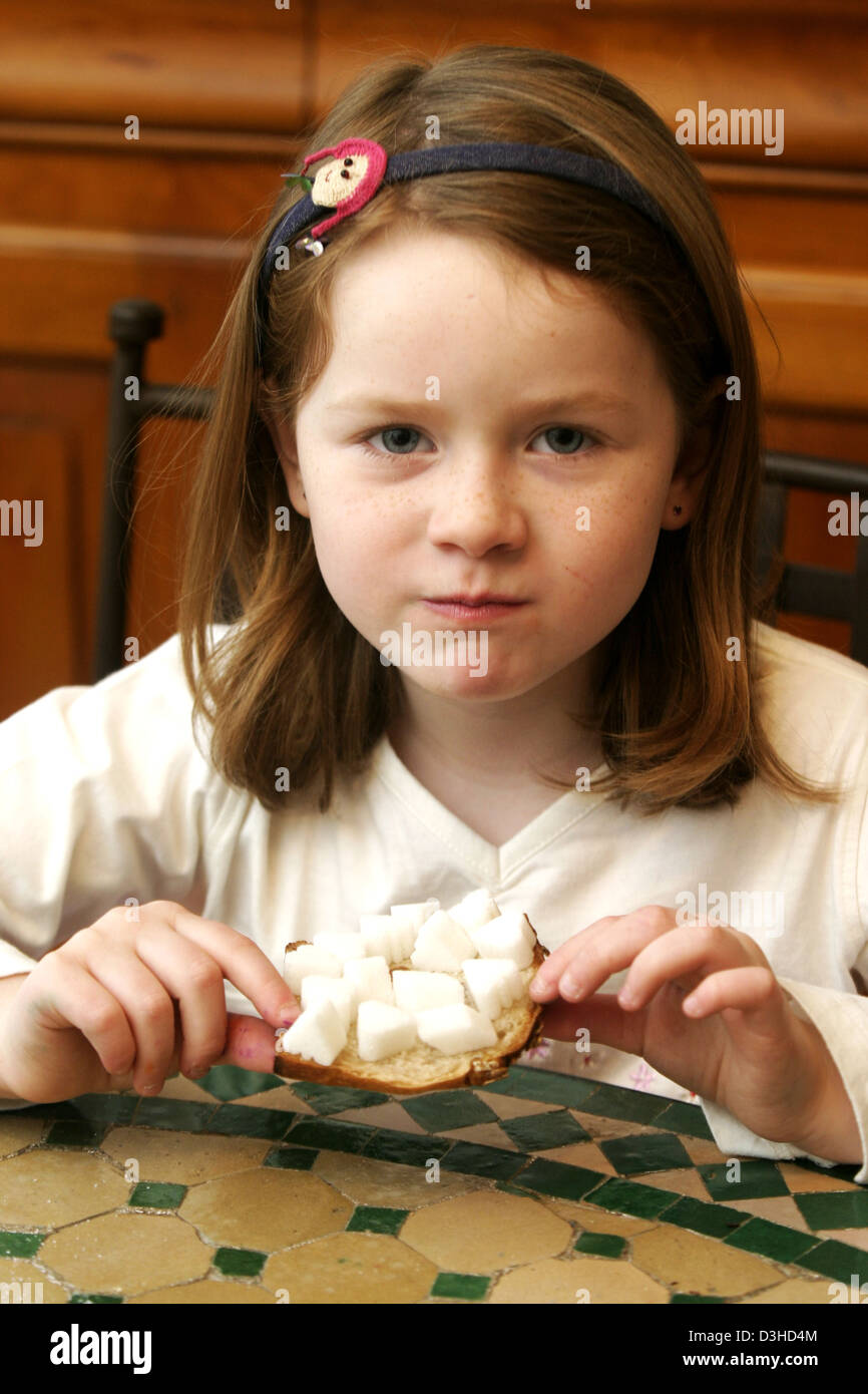 Child sugar cubes hi-res stock photography and images - Alamy