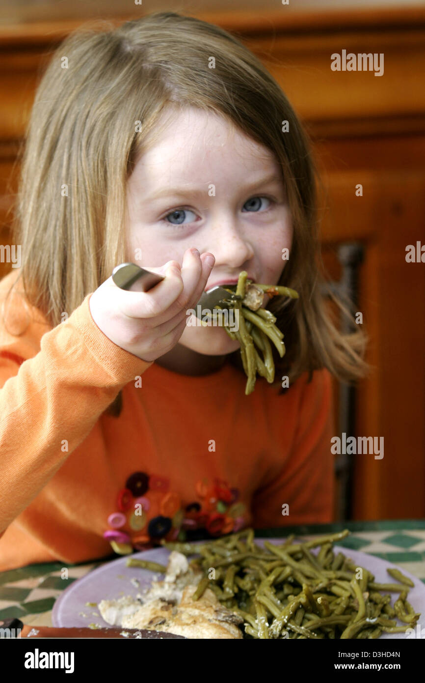 CHILD EATING MEAT Stock Photo - Alamy