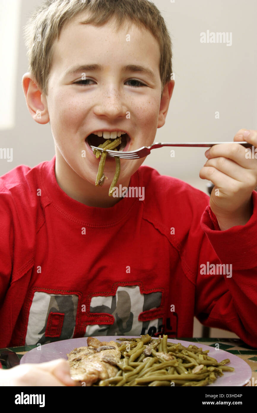CHILD EATING MEAT Stock Photo - Alamy