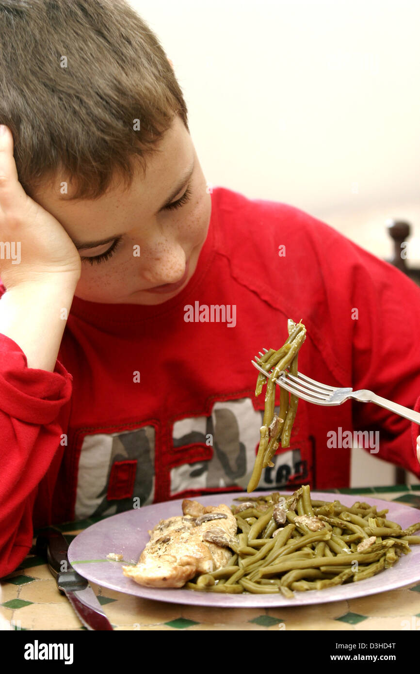 CHILD EATING MEAT Stock Photo - Alamy