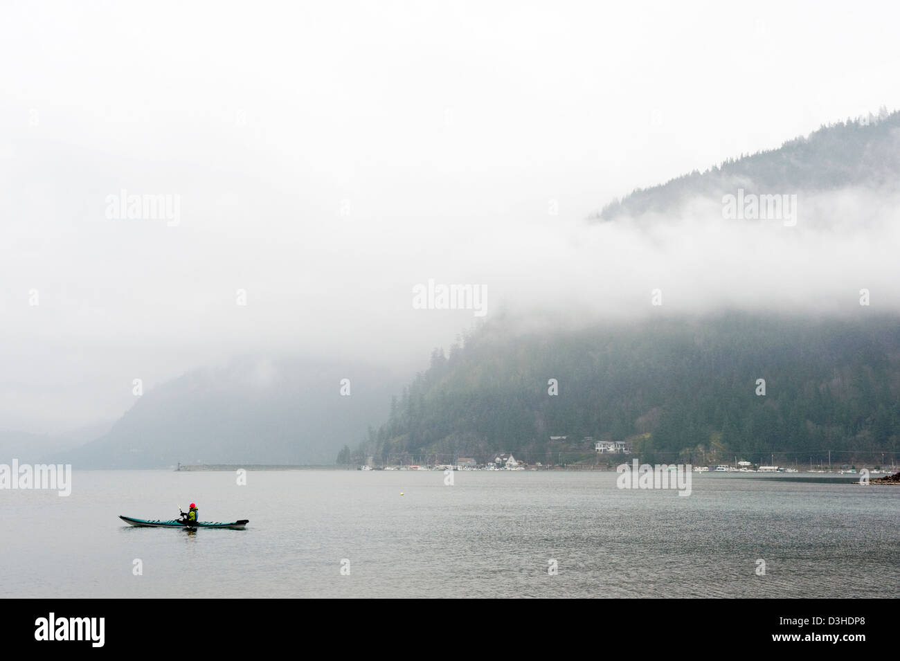 Kayakers paddle out on Harrison Lake at it's southern end, at the ...