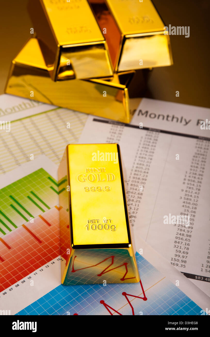 Gold bars with a linear graph Stock Photo - Alamy