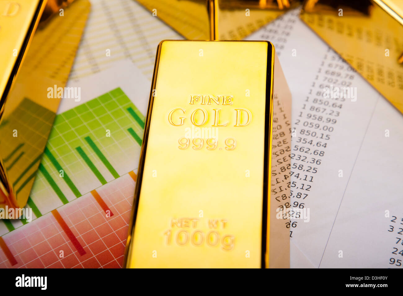 Gold bars with a linear graph Stock Photo - Alamy