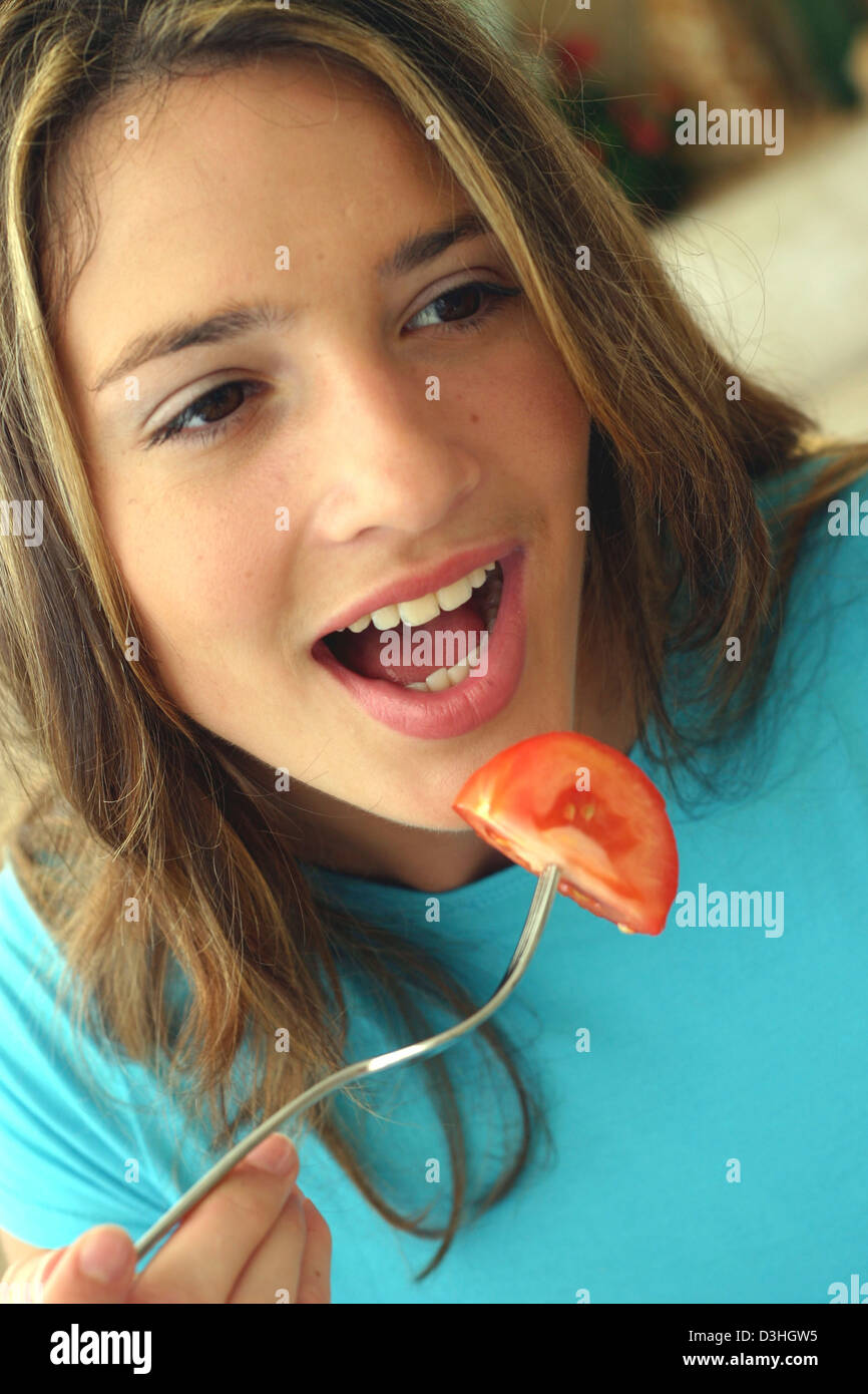 ADOLESCENT EATING SALAD Stock Photo - Alamy