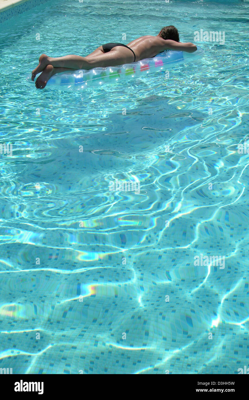 WOMAN TANNING IN SUMMER Stock Photo - Alamy