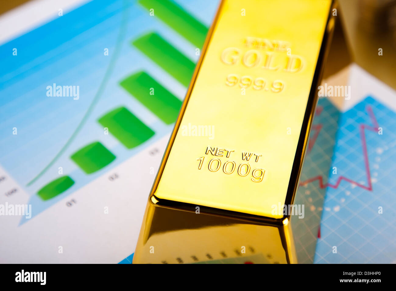 Gold bars with a linear graph Stock Photo - Alamy