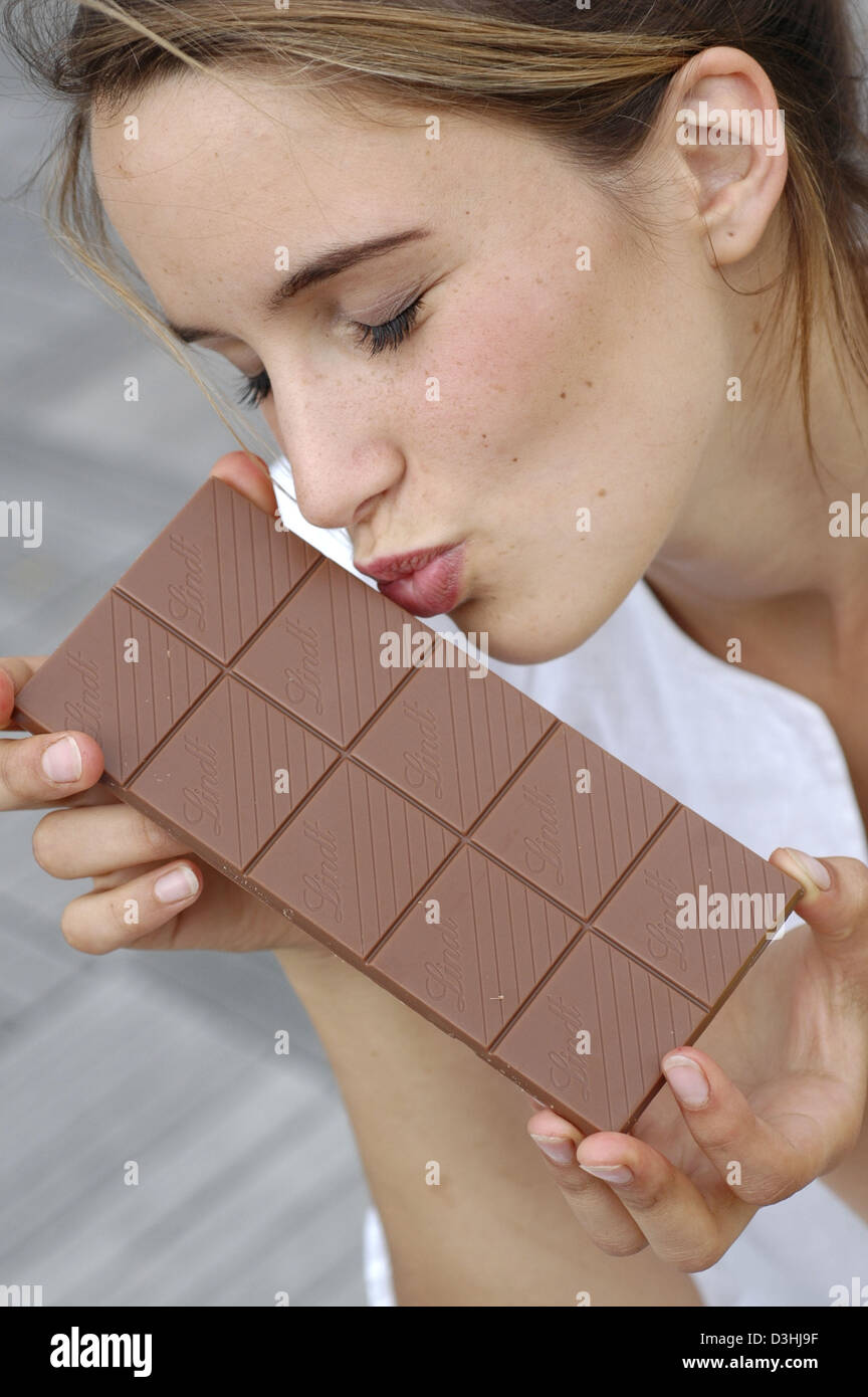 WOMAN EATING SWEETS Stock Photo - Alamy